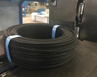 Cable coiler with strapper - Coiler