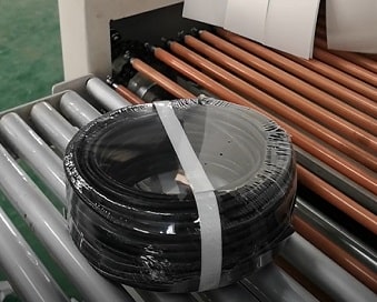 Cable coiler with strapper - Coiler